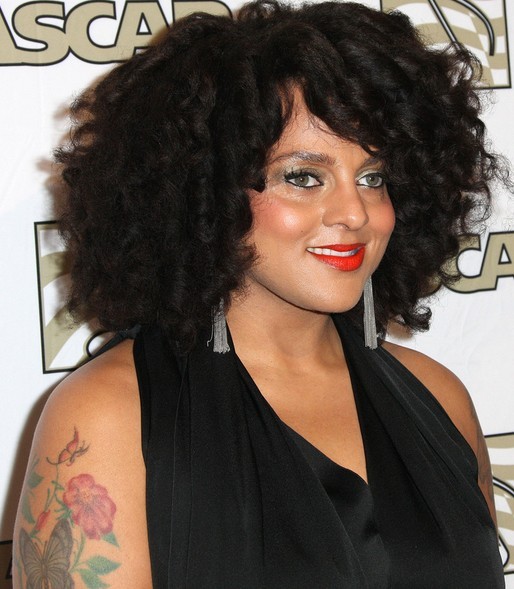 Marsha Ambrosius' Tattoos - Flower Tattoo on Upper Arm - Pretty Designs